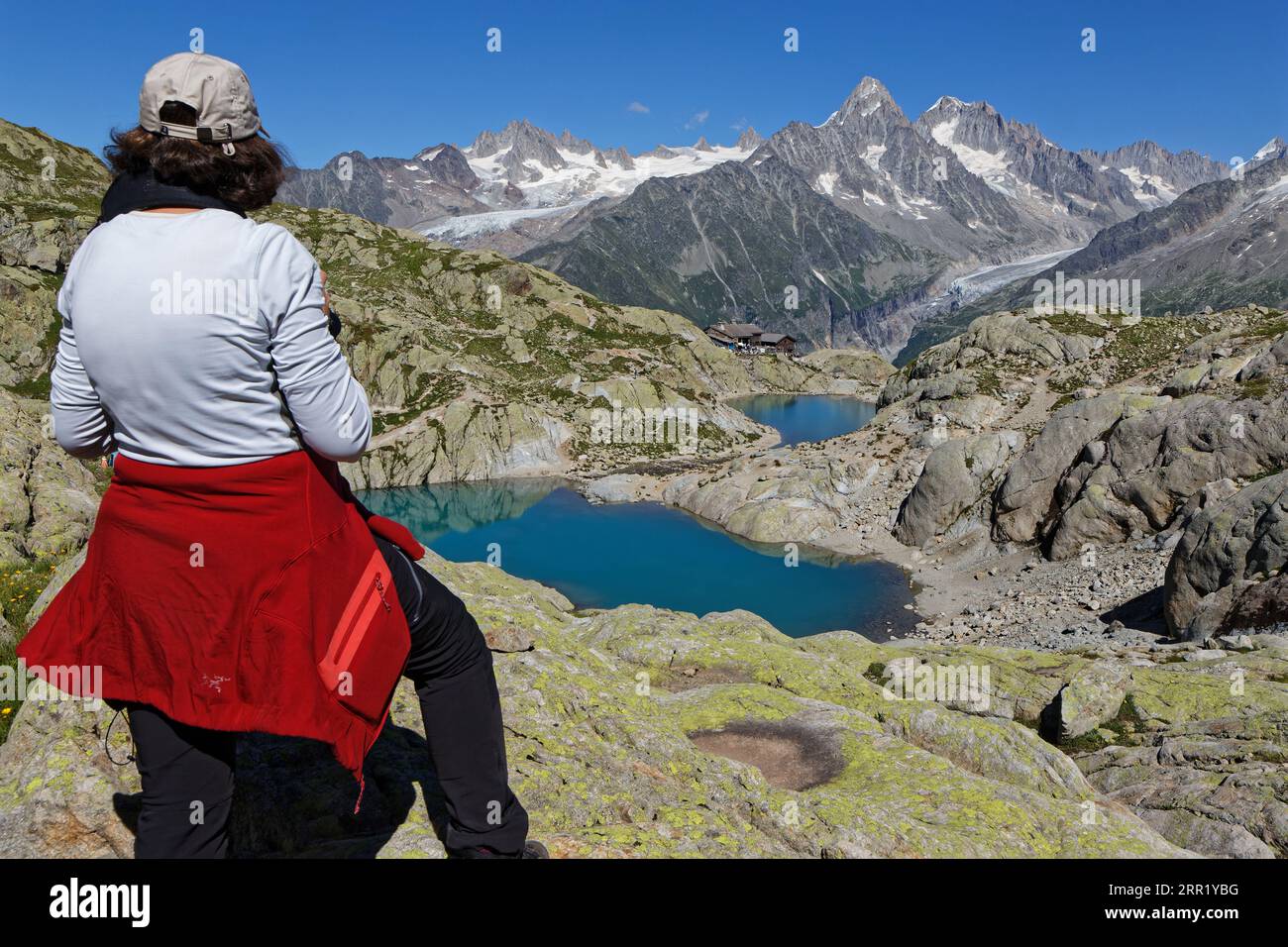 CHAMONIX, FRANCE, July 8, 2022 : Woman over Refuge du Lac Blanc in the ...