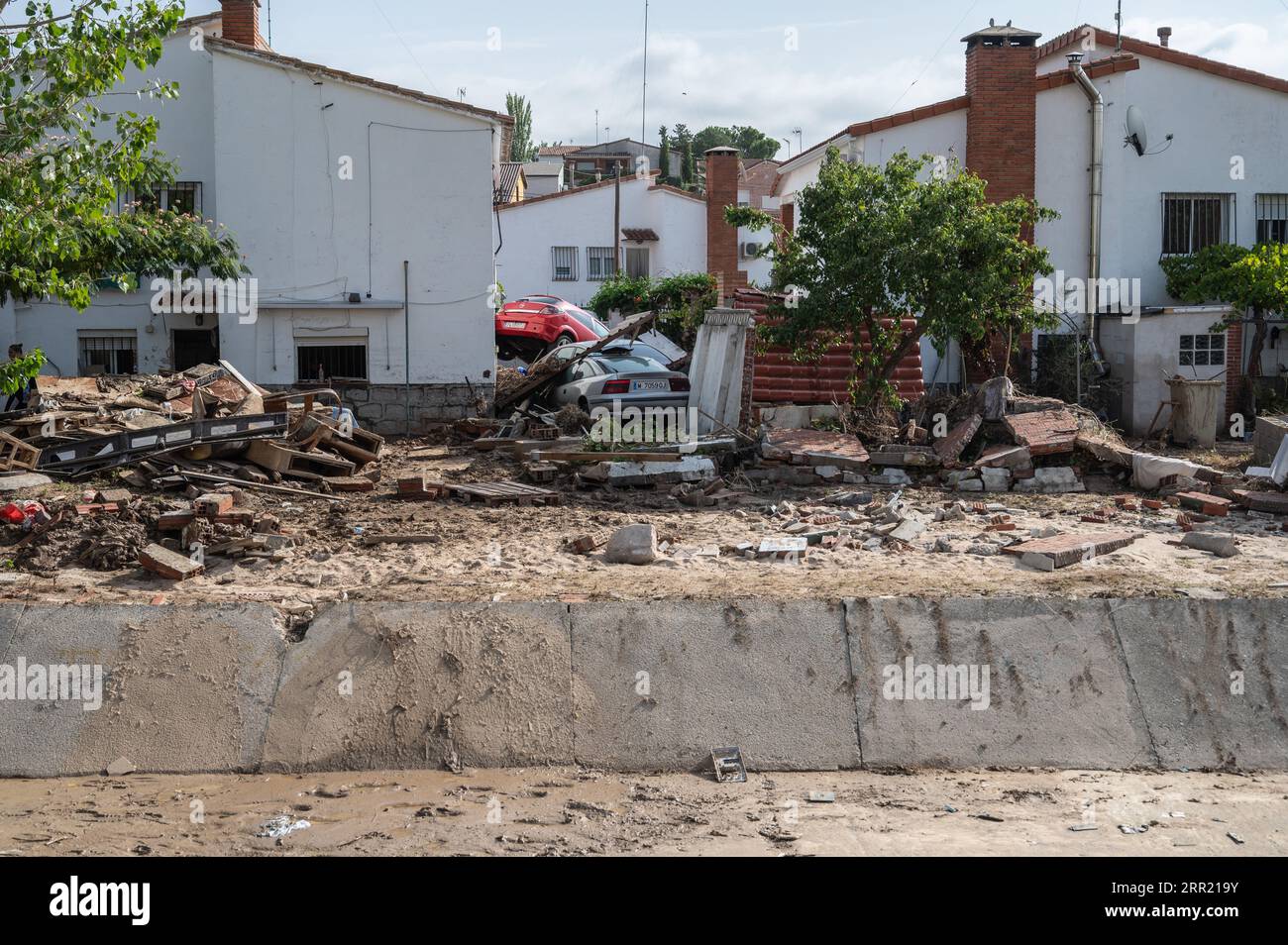 Madrid, Spain. 06th Sep, 2023. Cars are seen wedged between two houses ...
