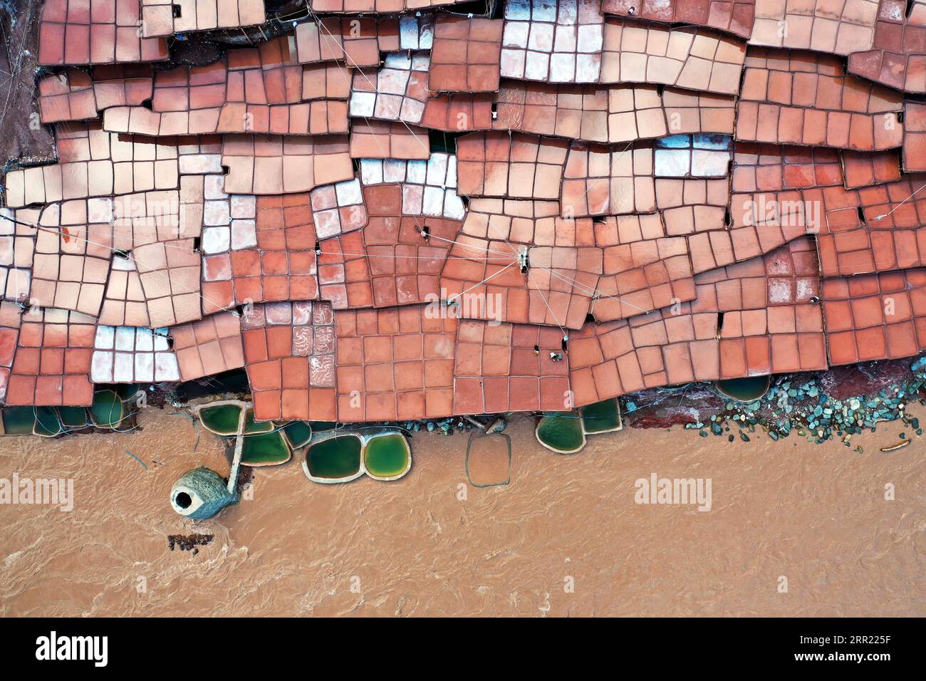 Collecting salt from salt pan hi-res stock photography and images - Alamy