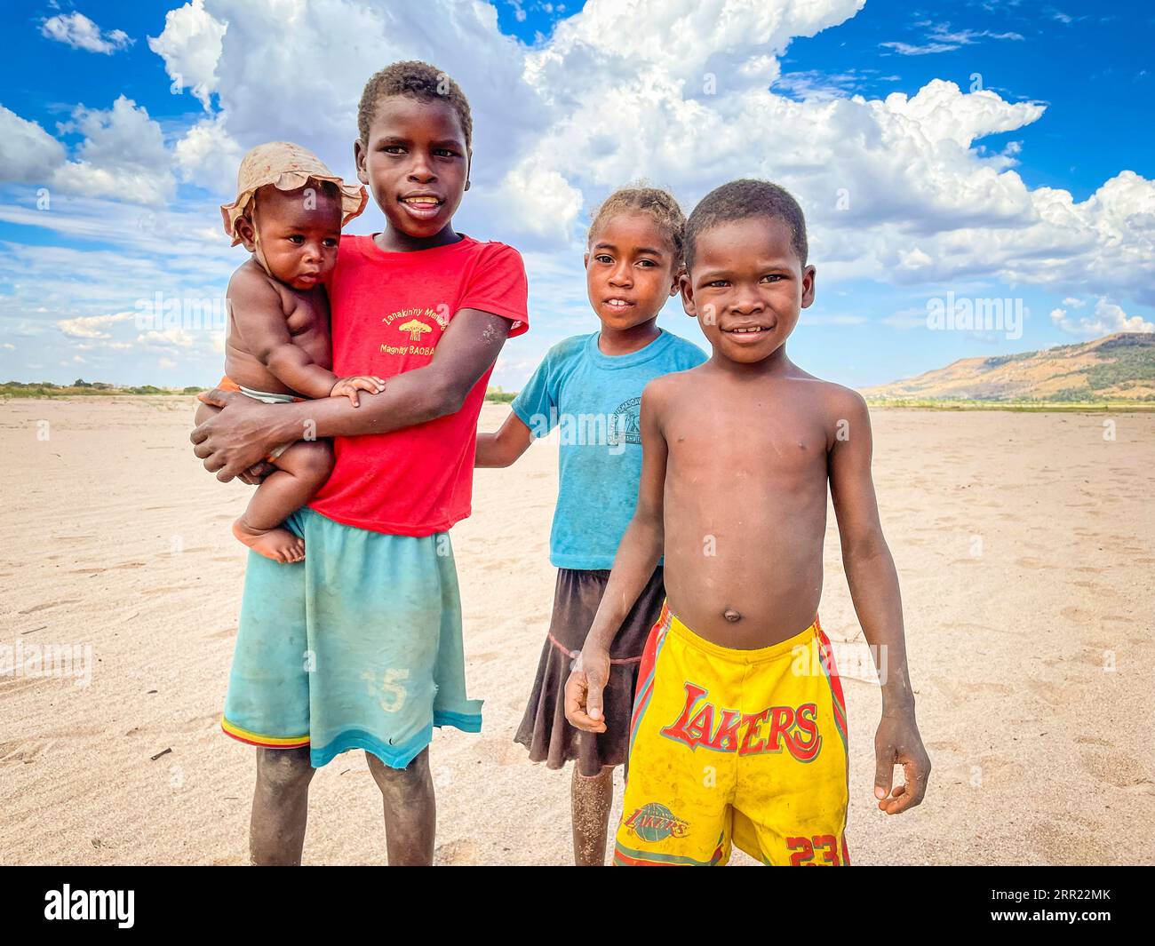Madagascar, Tsiribihina river, group of children on the sandy banks of ...