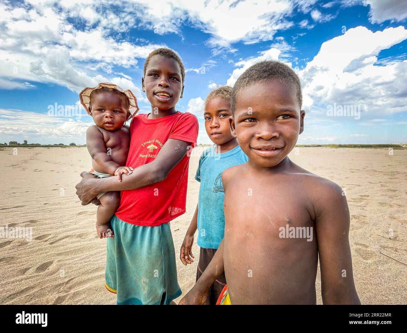 Madagascar, Tsiribihina river, group of children on the sandy banks of ...