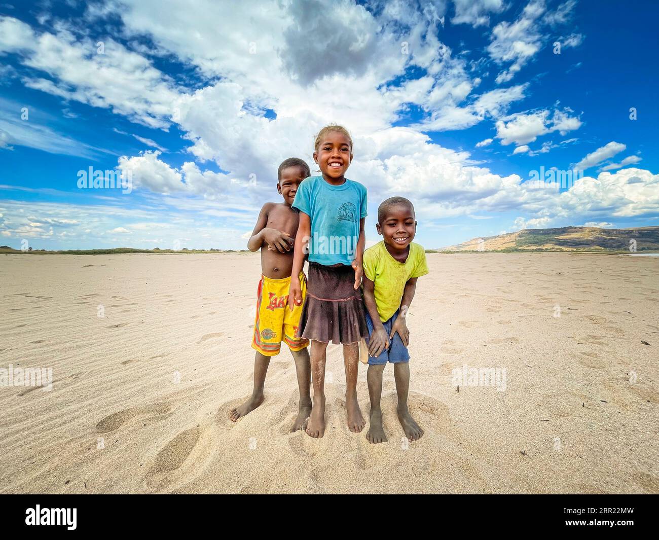 Madagascar, Tsiribihina river, group of children on the sandy banks of ...