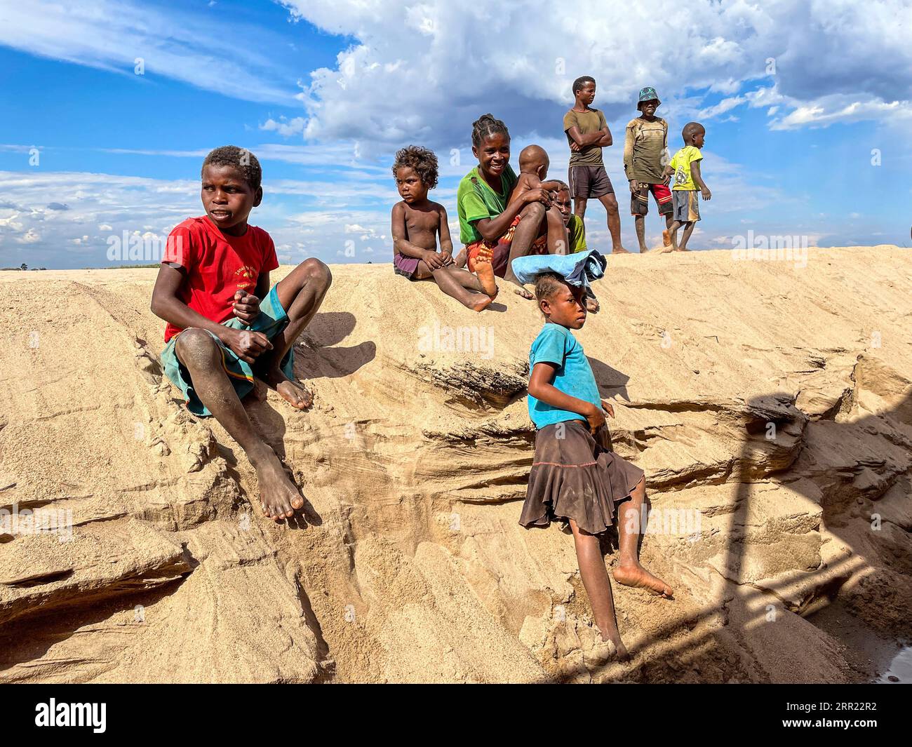 Madagascar, Tsiribihina river, group of children on the sandy banks of ...