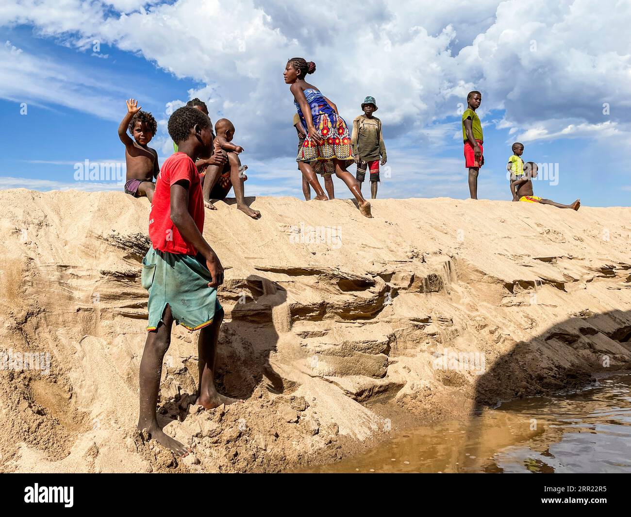 Madagascar, Tsiribihina river, group of children on the sandy banks of ...