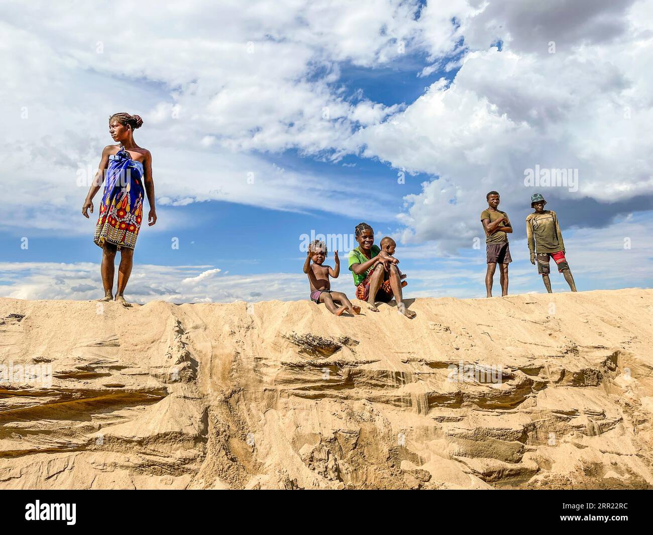 Madagascar, Tsiribihina river, group of children on the sandy banks of ...