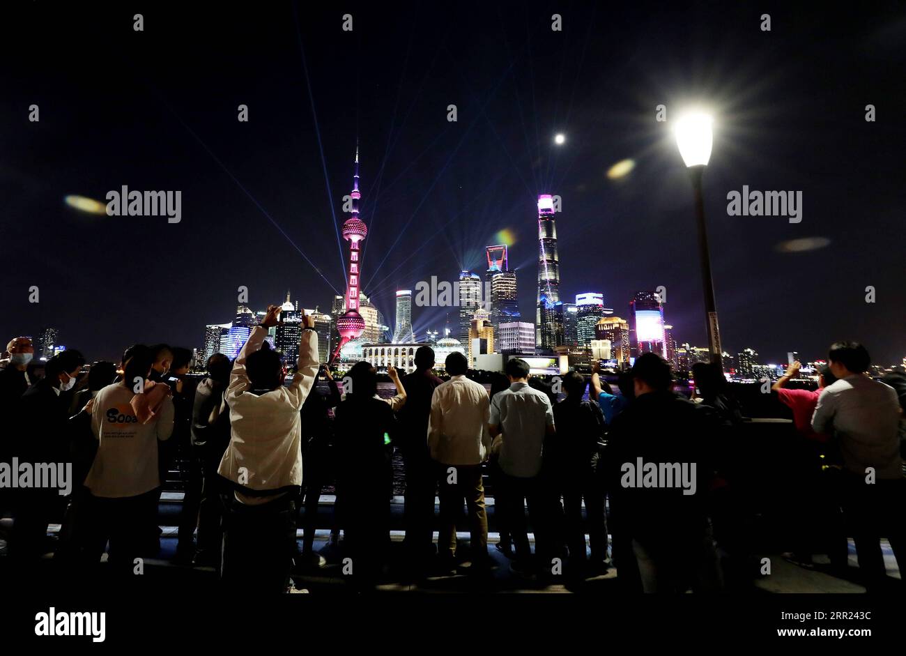 201001 -- SHANGHAI, Oct. 1, 2020 -- People enjoy a light show at the ...