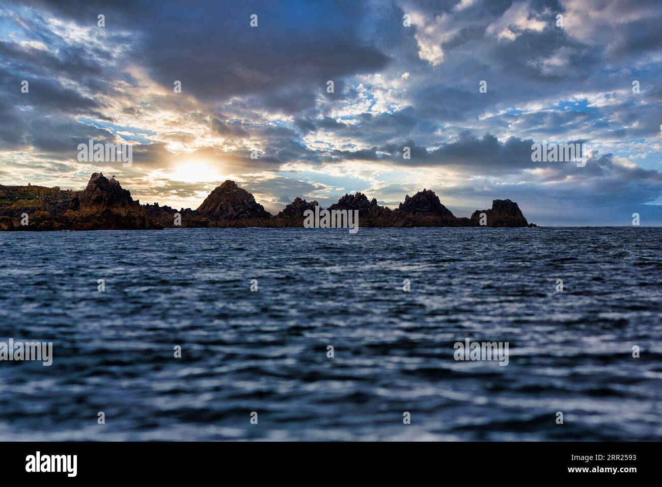 Coastline, silhouette of rocky islands in the sea, sunset, Isles of ...