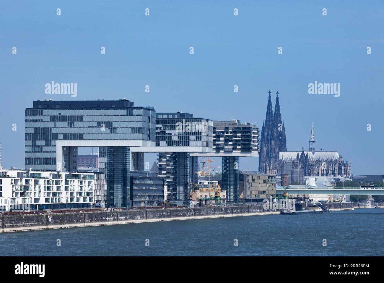 City view of the Rheinauhafen in Cologne with the 3 crane houses ...