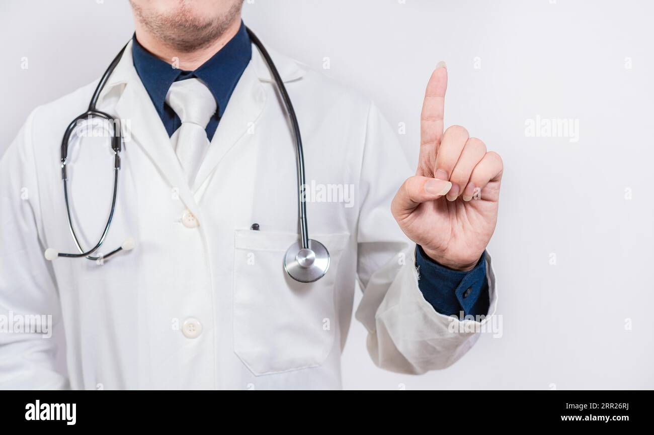 Unrecognizable doctor pointing up. Hand of doctor pointing up. Doctor ...