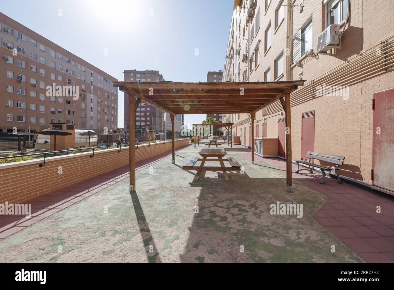 Some wooden gazebos with wooden tables underneath in the common areas ...