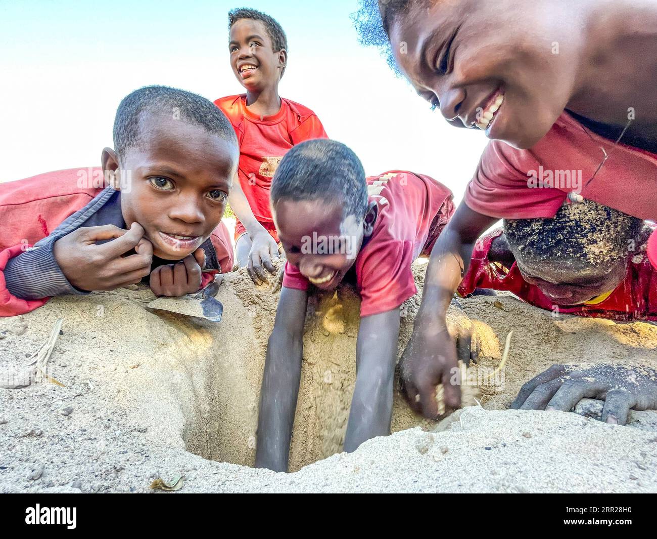 Madagascar, Tsiribihina river, children play on the banks of the river ...