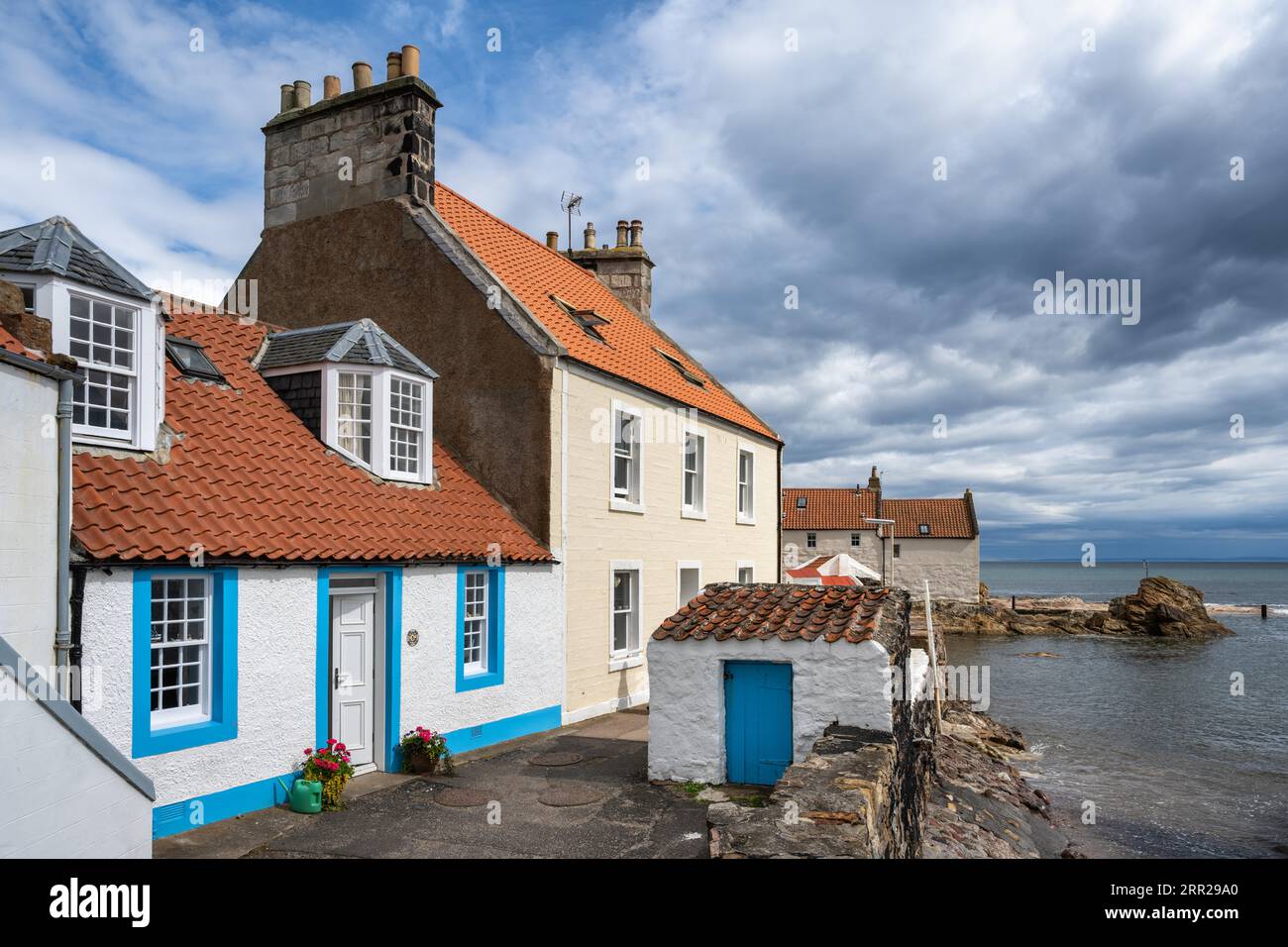 Traditional old dwellings lined up along the Fife Coastal Path in the ...