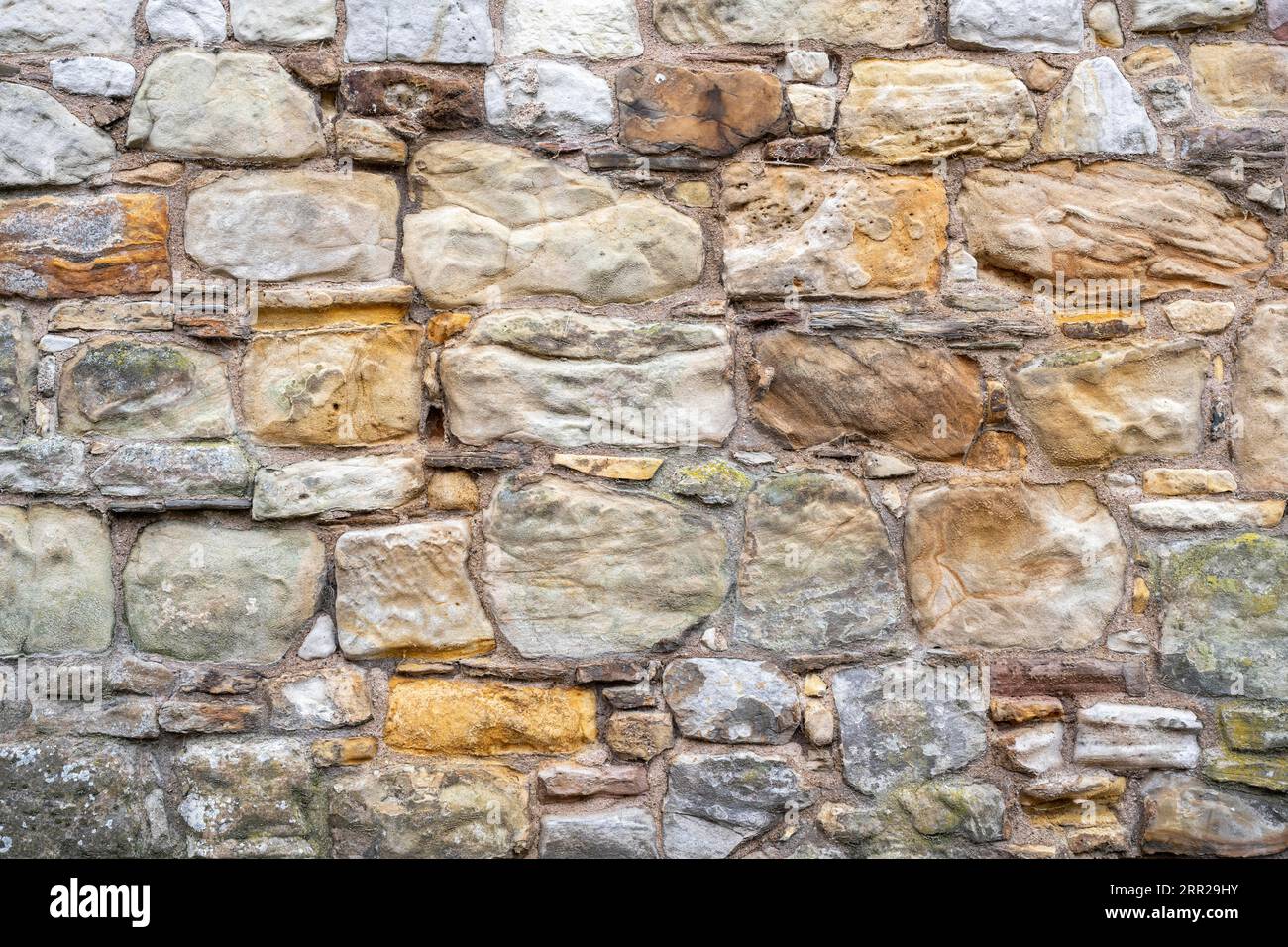 Wall stones made of different types of stone, full-size, background, St ...