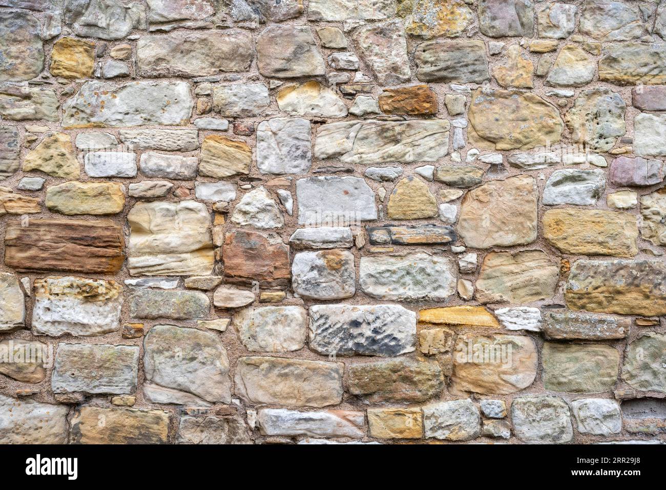 Wall stones made of different types of stone, full-size, background, St ...