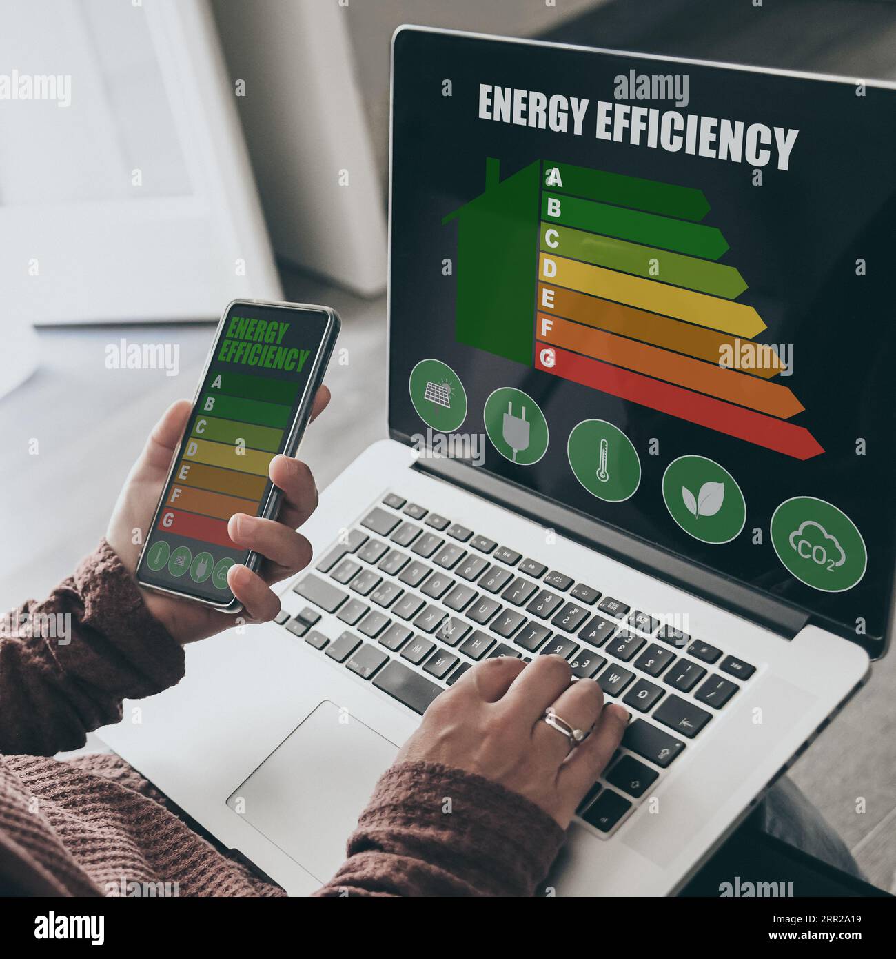 Woman calculating energy buildings efficiency class. Ecological and bio ...