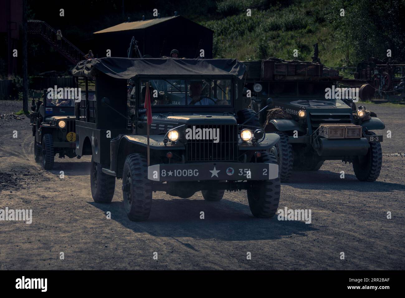 Convoy of army vehicles on a dusty road Stock Photo - Alamy