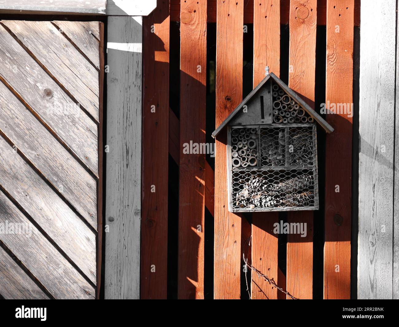 an insect hotel on the wall of an outhouse Stock Photo - Alamy