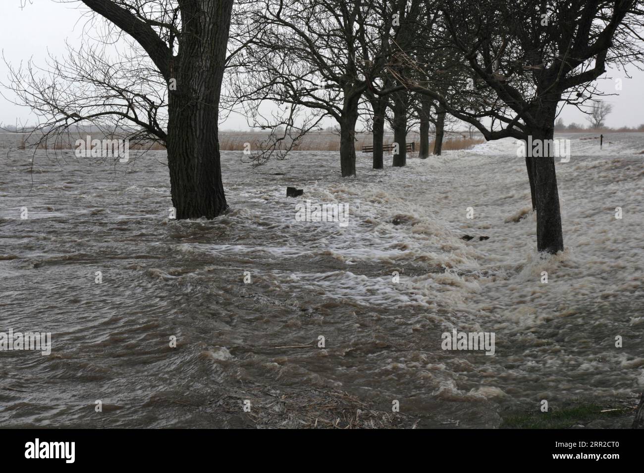Overtopping of the dike during a storm surge on the Lower Weser island ...