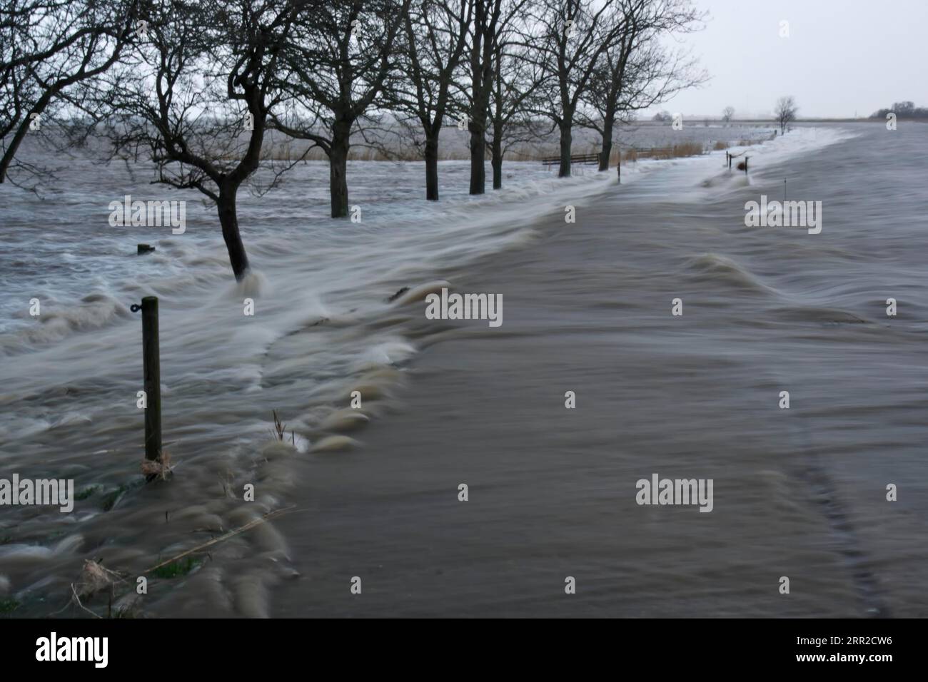 Overtopping of the dike during a storm surge on the Lower Weser island ...