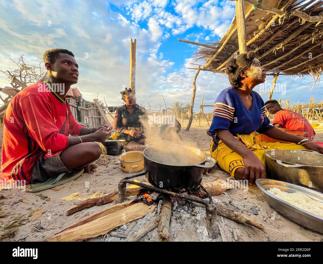 Madagascar, villagers intent on cooking traditional food Stock Photo ...