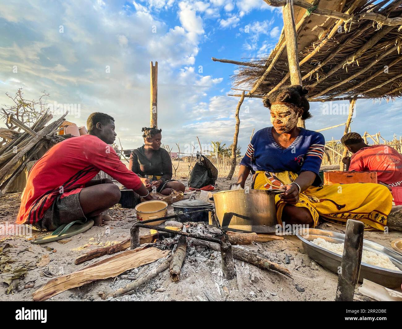 Madagascar, villagers intent on cooking traditional food Stock Photo ...