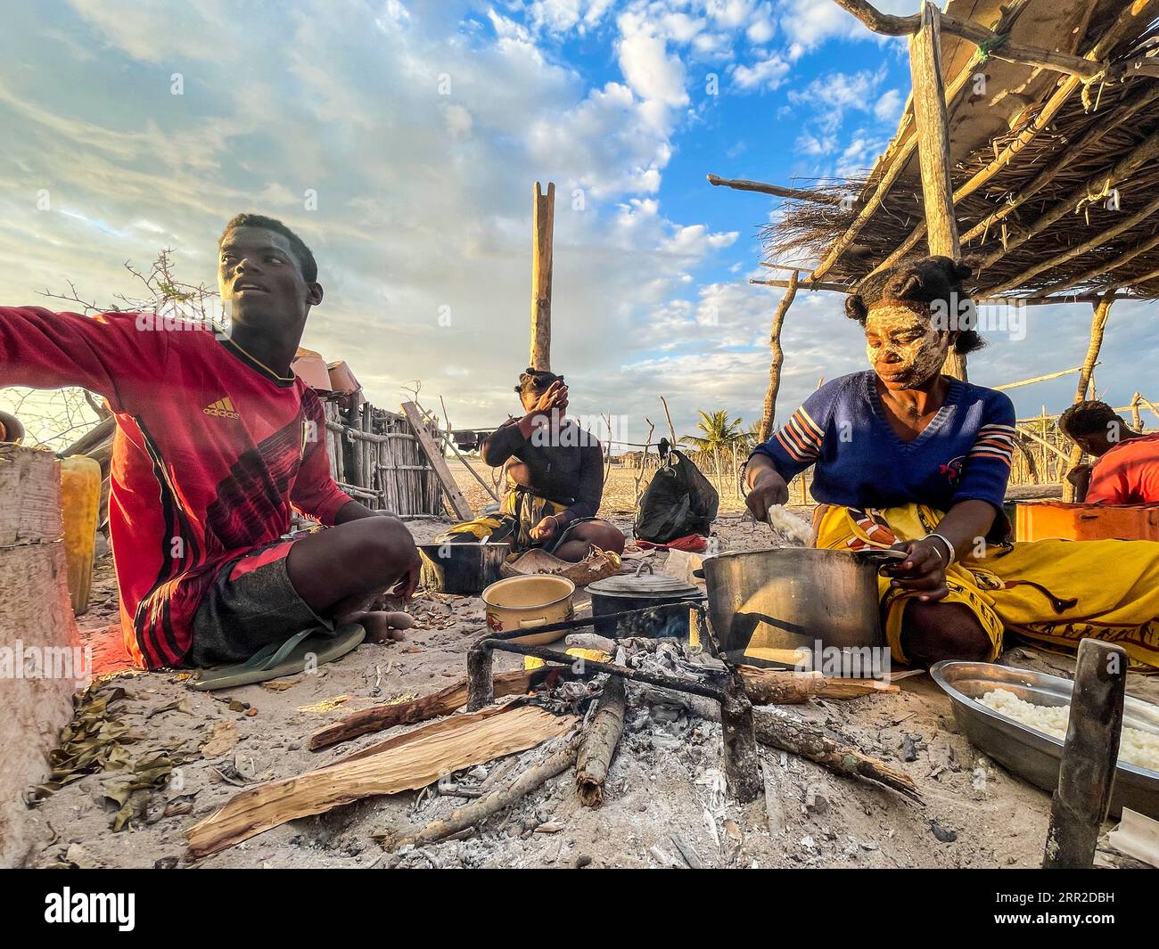 Madagascar, villagers intent on cooking traditional food Stock Photo ...
