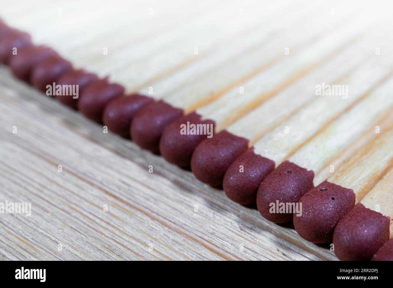 A closeup view of a pack of wooden matches, their heads and bodies ...