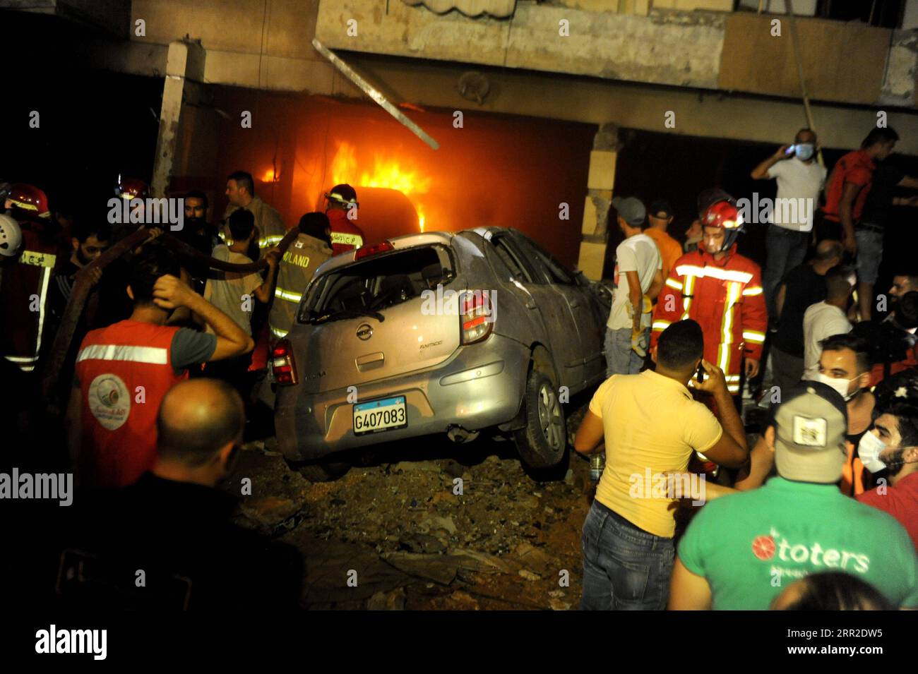 201009 -- BEIRUT, Oct. 9, 2020 -- Civil defense members work on the ...