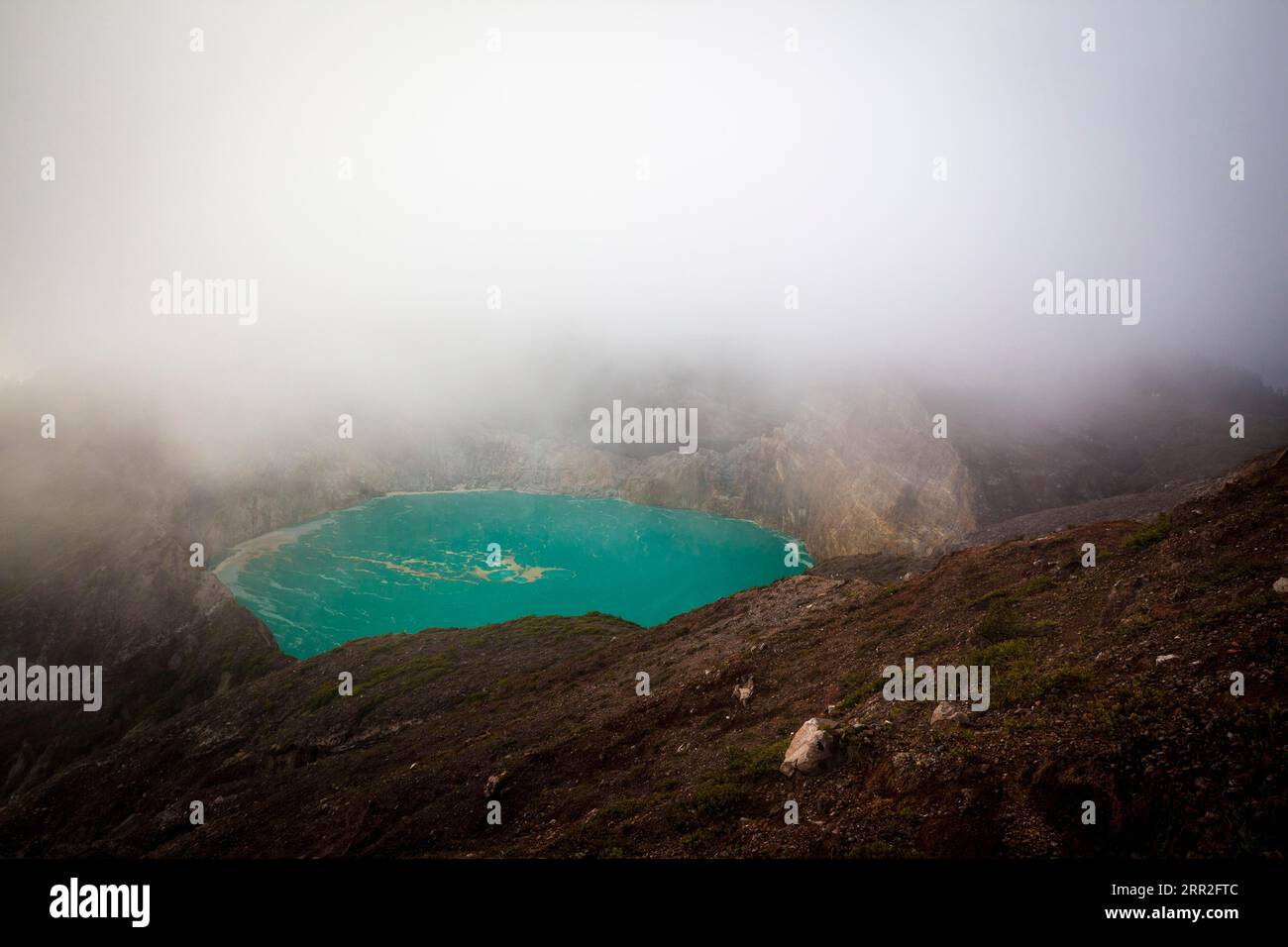 Fog over crater with turquoise crater lake, Kelimutu Volcano, Kelimutu ...