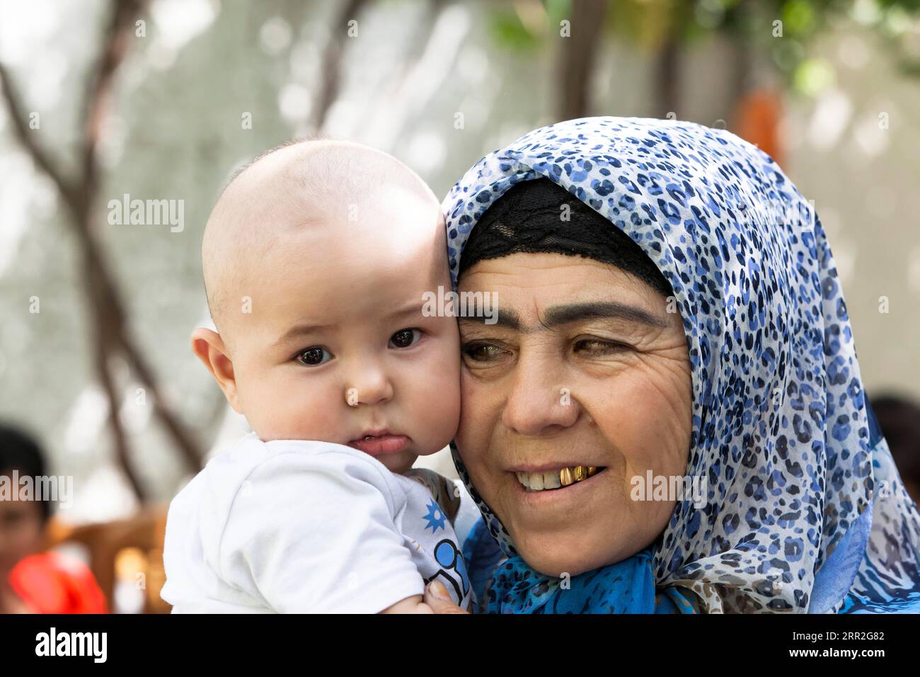 Grandmother and baby, Uzbekistan Stock Photo - Alamy
