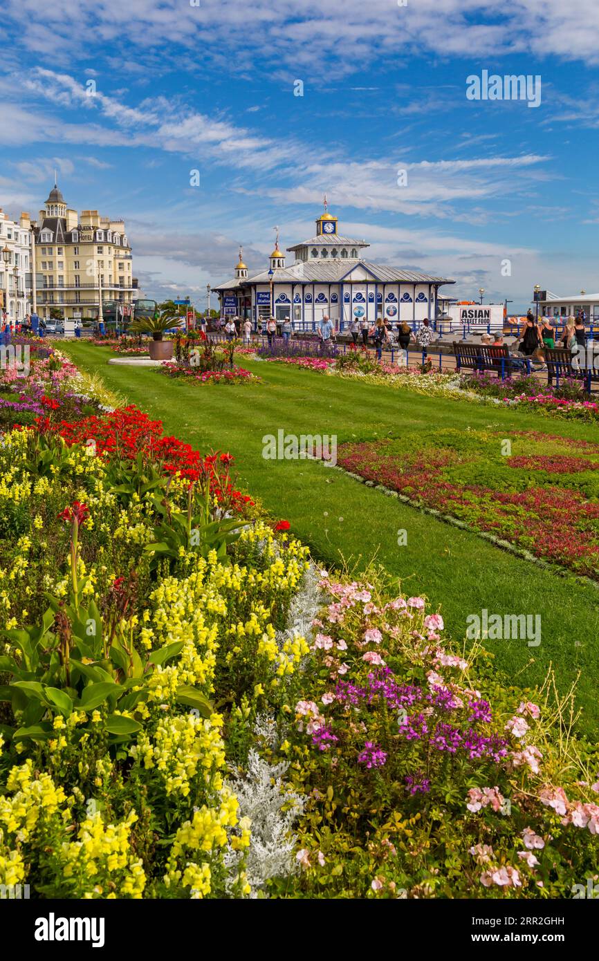 Flowers along promenade seafront with Queens Hotel and Pier entrance in ...