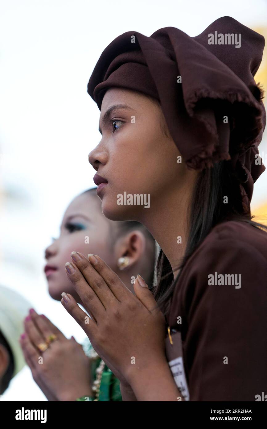 Young woman praying, Taungu, Bago Division, Myanmar, Burma Stock Photo ...