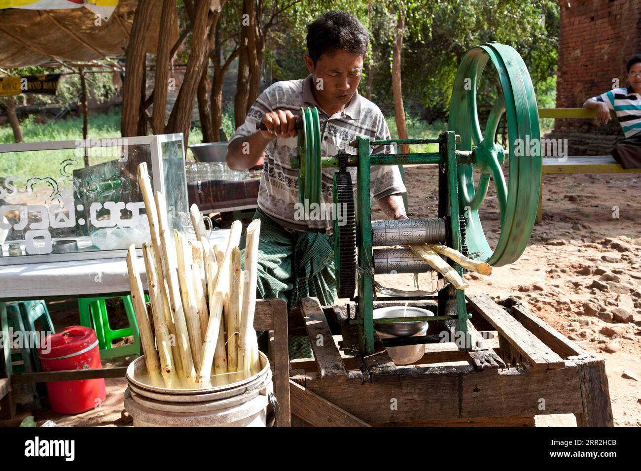 Man pressing sugar cane juice, Bagan, Mandalay Division, Myanmar, Burma ...