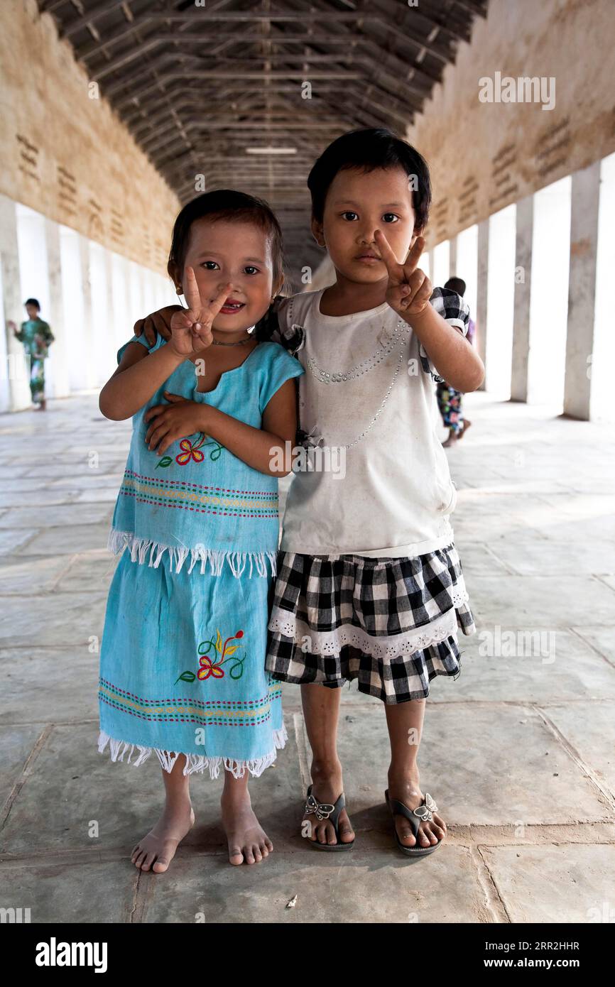 Two girls making Victory sign, Bagan, Mandalay Division, Myanmar, Burma ...