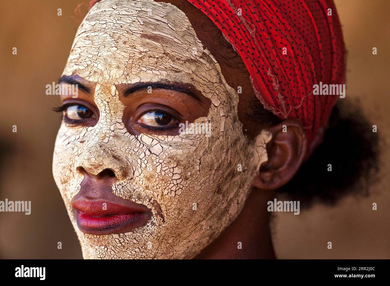 Woman with face mask, Vezo tribe, semi-nomads in the south, Madagascar ...