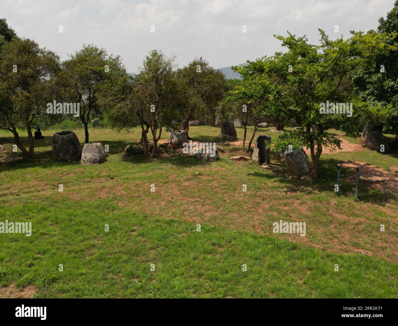 The historic Plain of Jars on a grassy green field in Laos Stock Photo ...