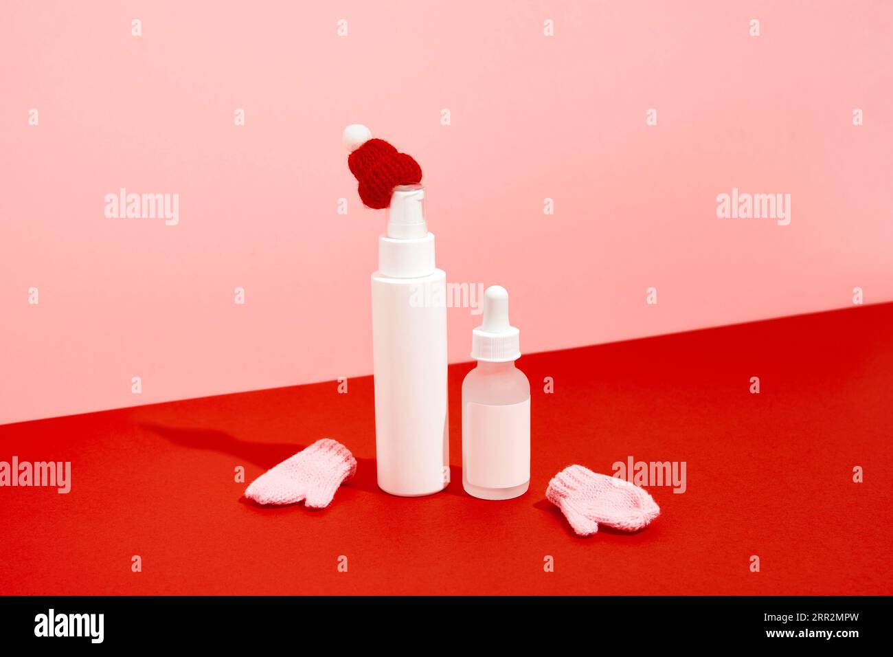 White plastic cosmetic bottle and dropper with tiny hat and gloves pink ...