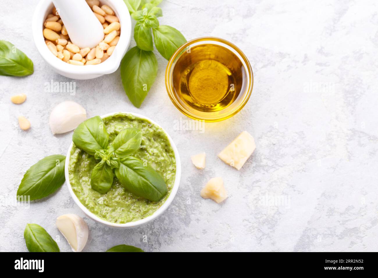 Pesto sauce and ingredients, cheese, basil, garlic, pine nuts, olive ...