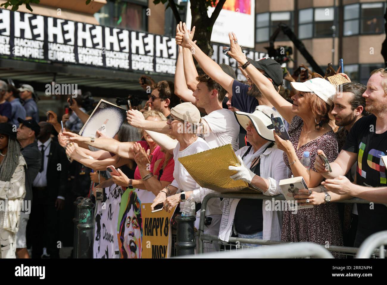 Fan wave outside the Hackney Empire in London, as the Rolling Stones ...
