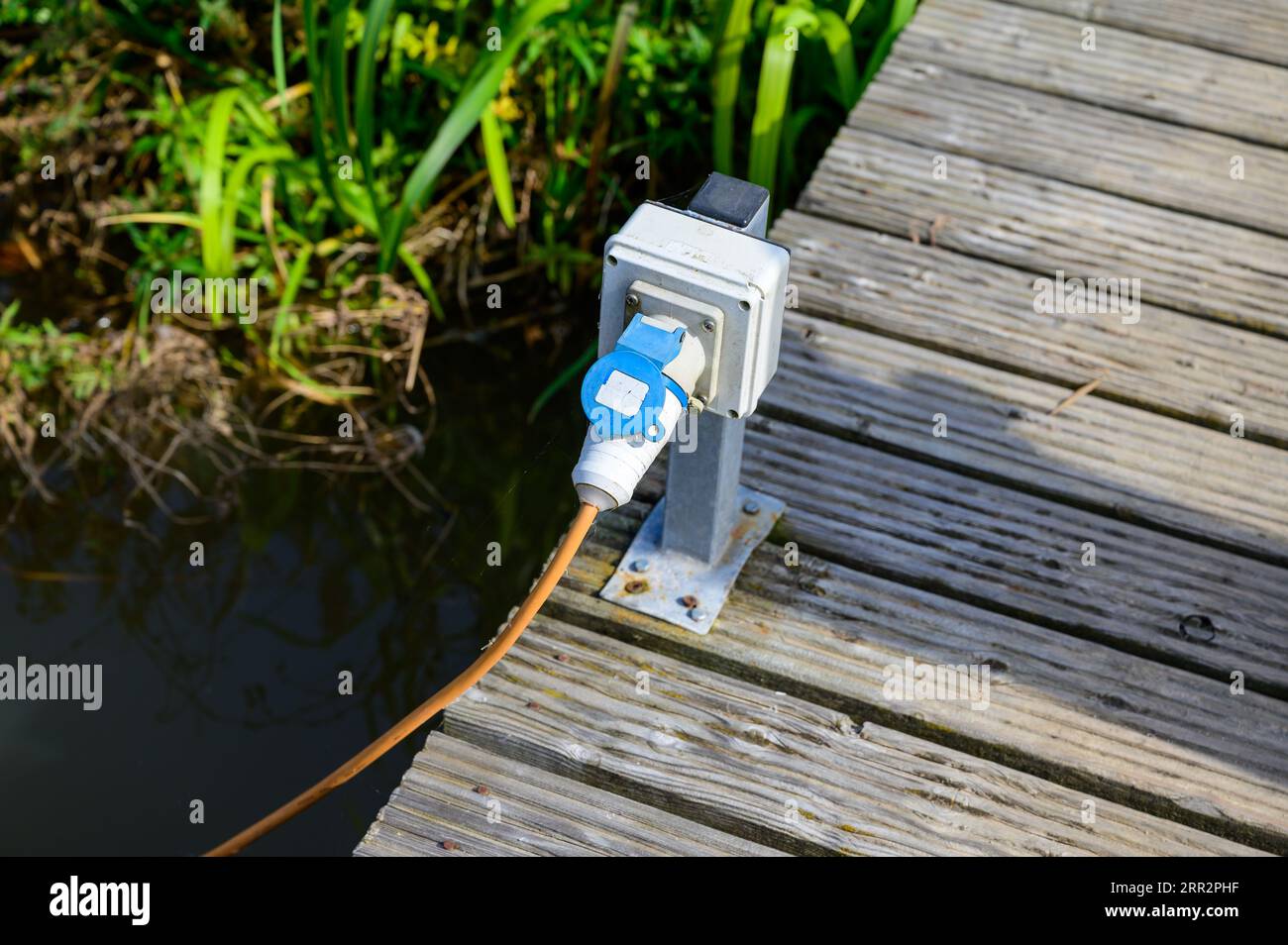 Boats connected to charging cables hi-res stock photography and images ...