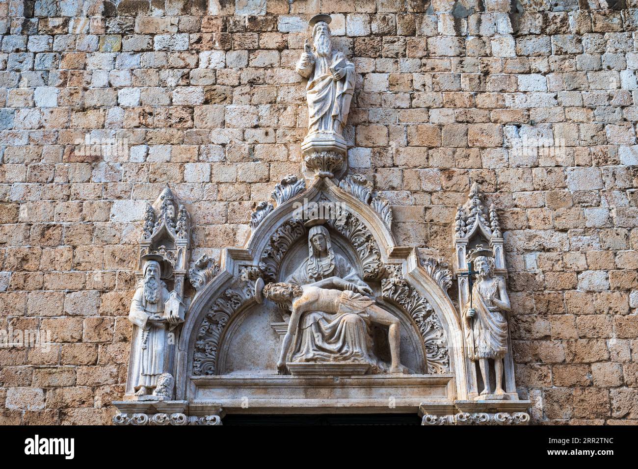 Pieta sculpture above side entrance to Franciscan Monastery on Stradun ...