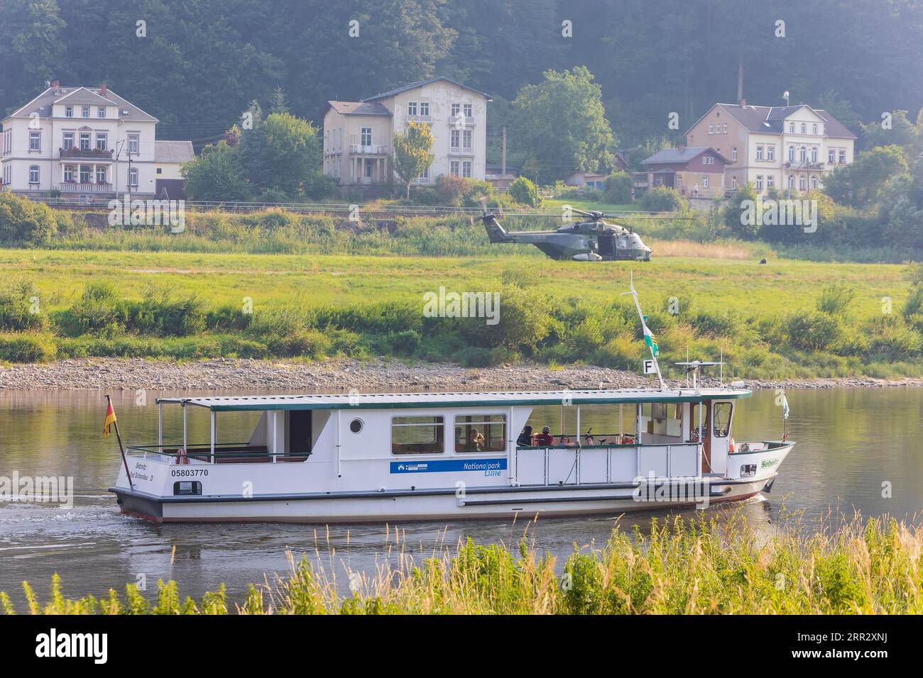 A Bundeswehr helicopter lands on the Elbe meadows in Bad Schandau on ...
