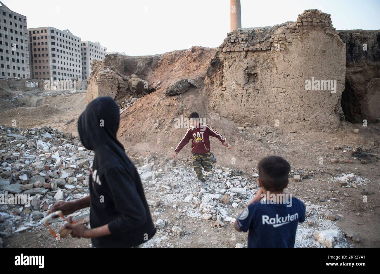 201017 -- TEHRAN, Oct. 17, 2020 -- Children play in a slum on the ...