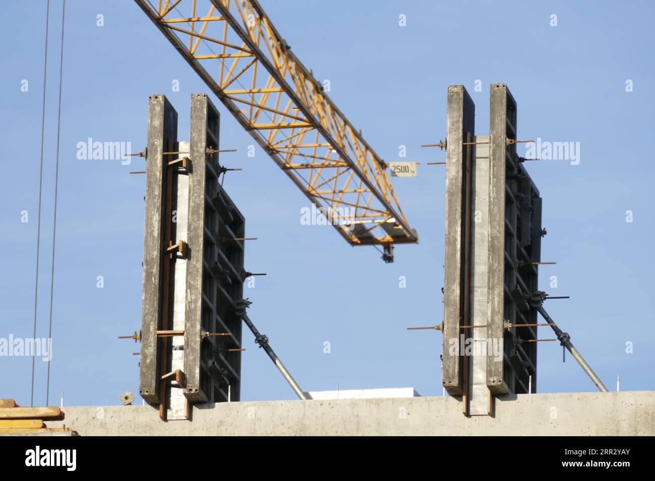 Shell of a commercial building, construction site, construction crane ...