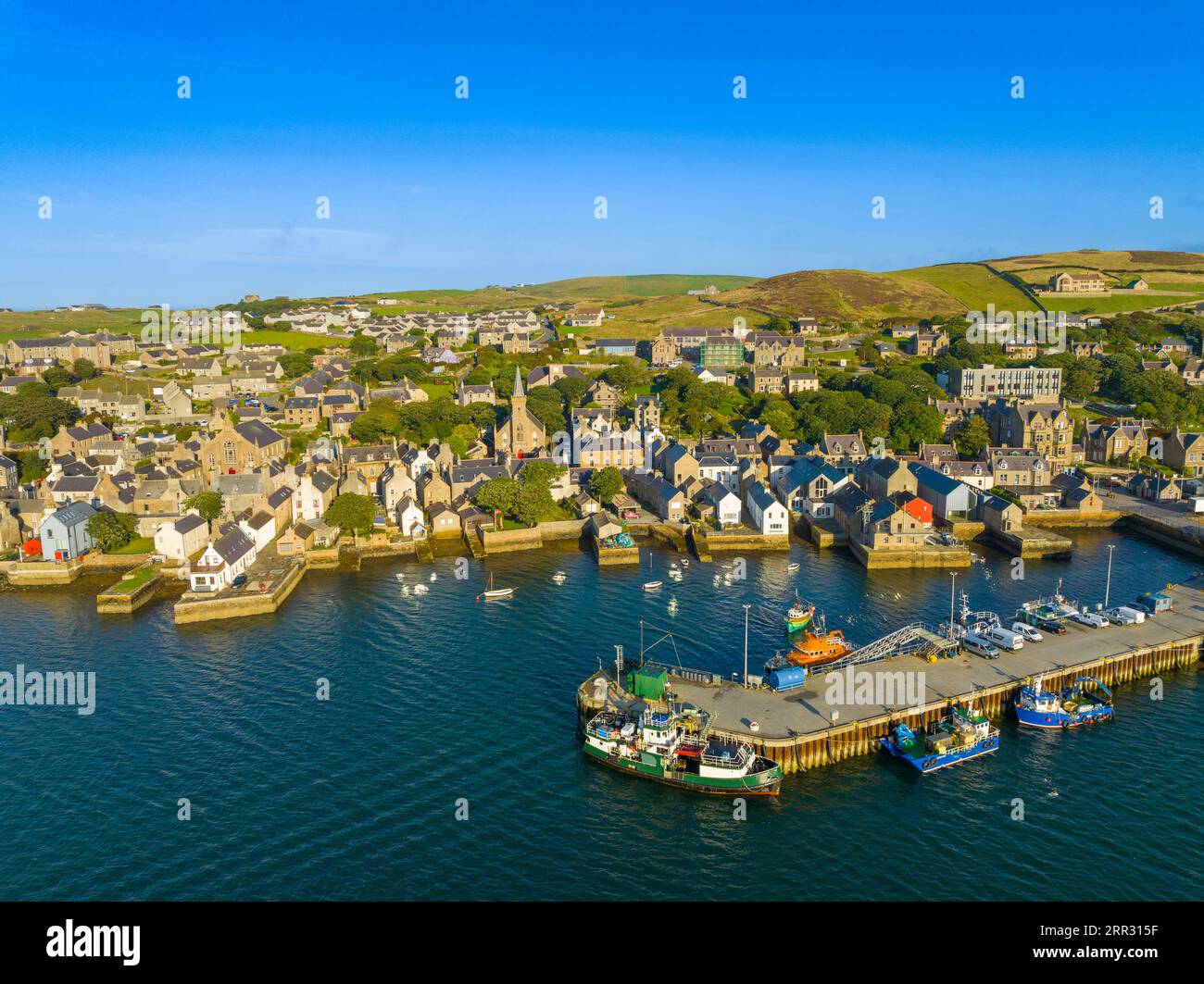 Aerial view of Stromness waterfront in early morning light on West ...