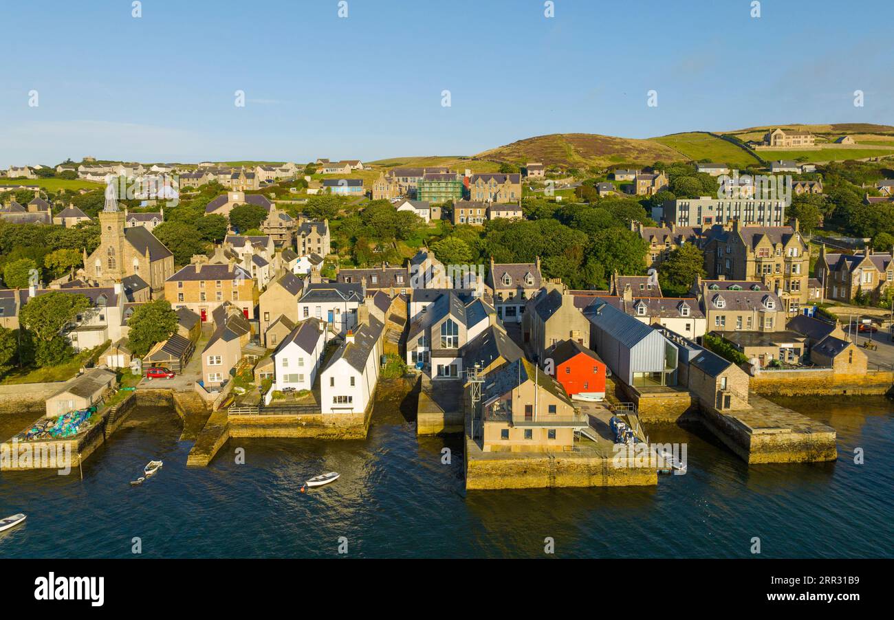 Aerial view of Stromness waterfront in early morning light on West ...
