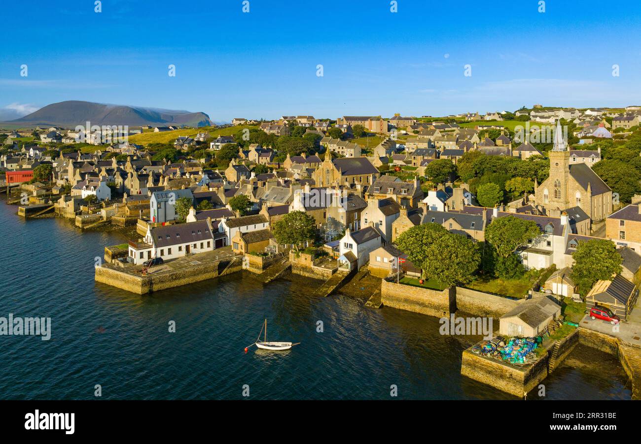 Aerial view of Stromness waterfront in early morning light on West ...