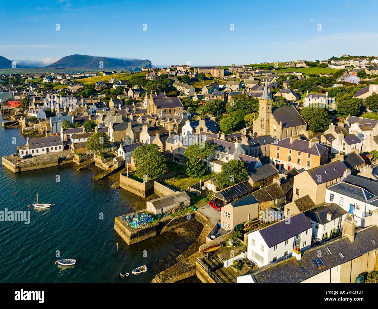 Aerial view of Stromness waterfront in early morning light on West ...