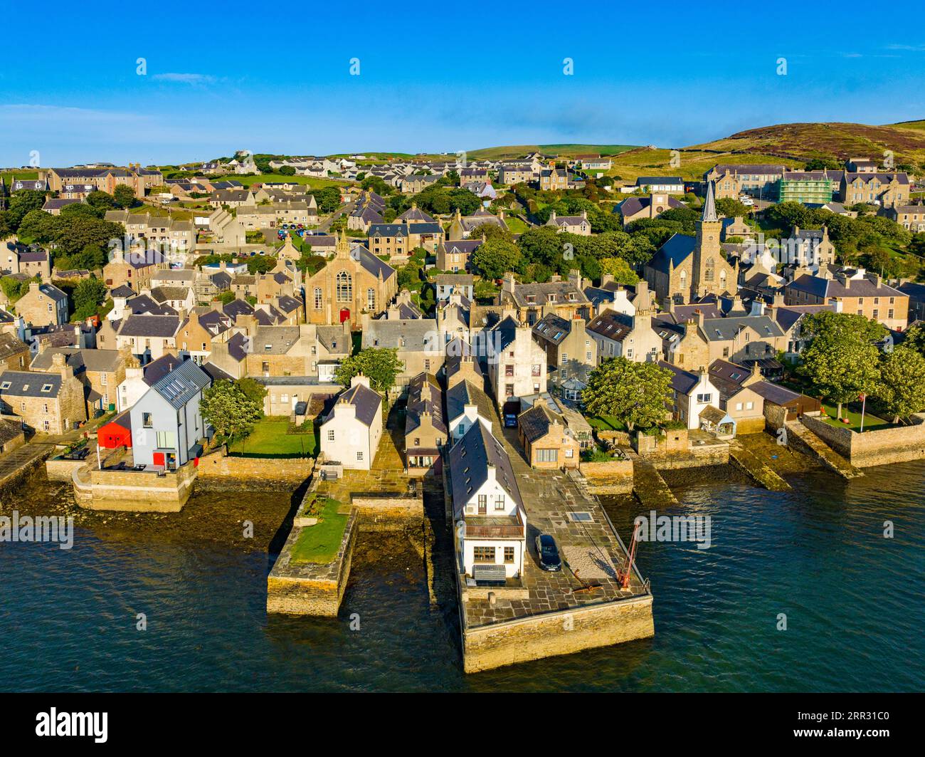 Aerial view of Stromness waterfront in early morning light on West ...