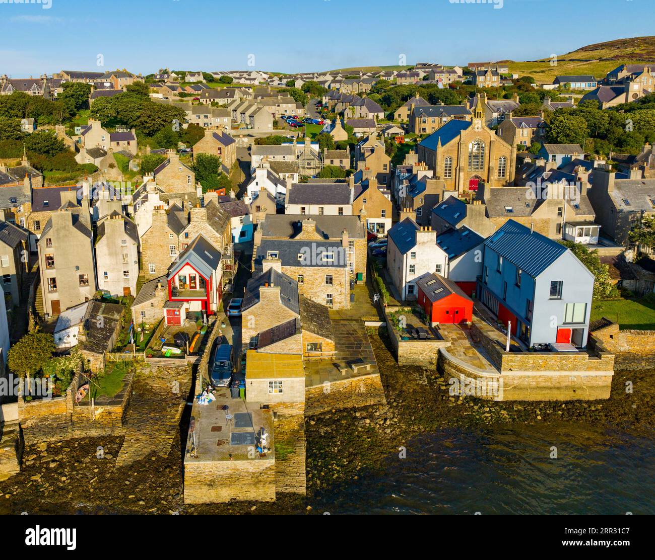 Aerial view of Stromness waterfront in early morning light on West ...